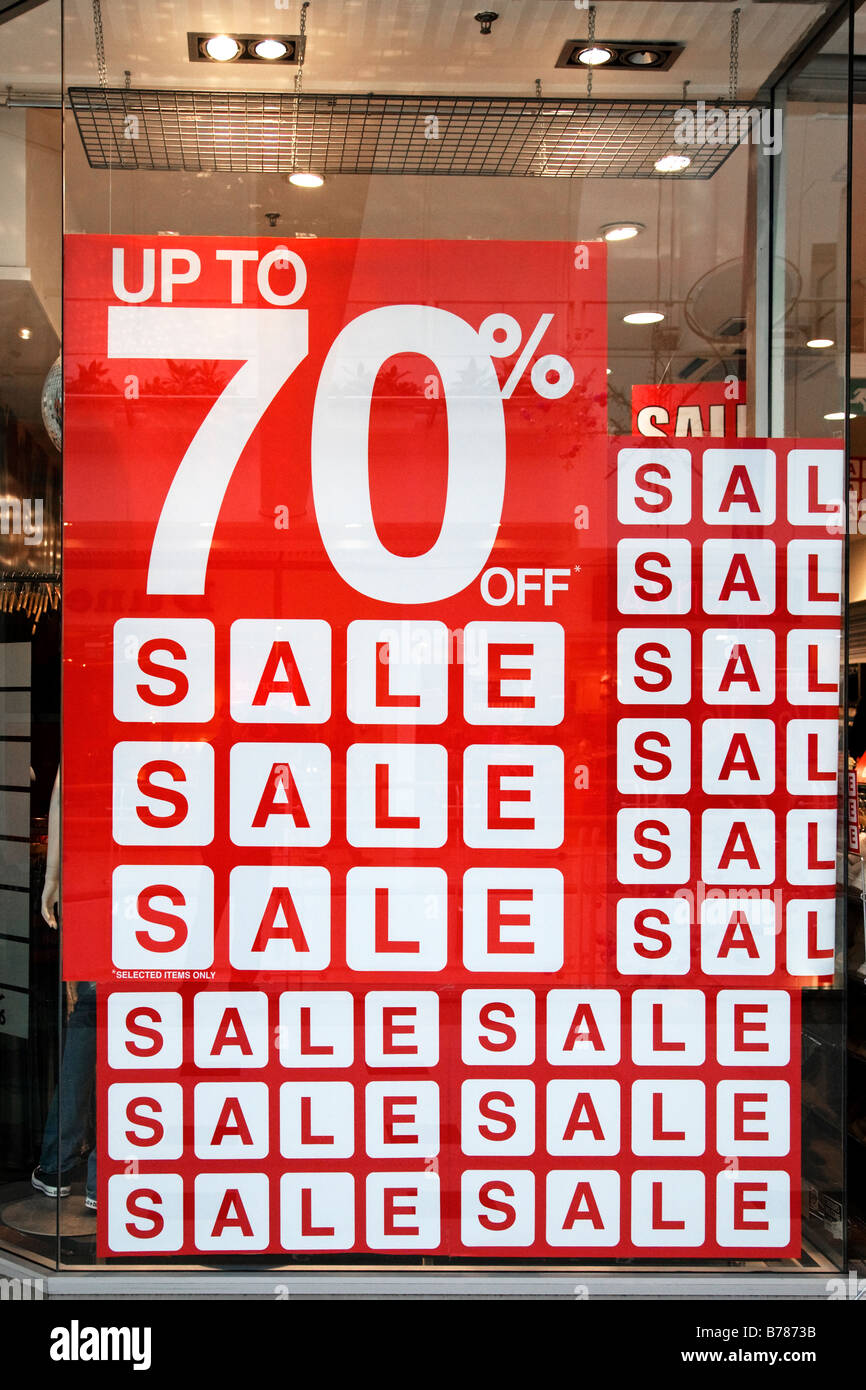 Sign in a retail store window advertising up to 70% off Stock Photo - Alamy