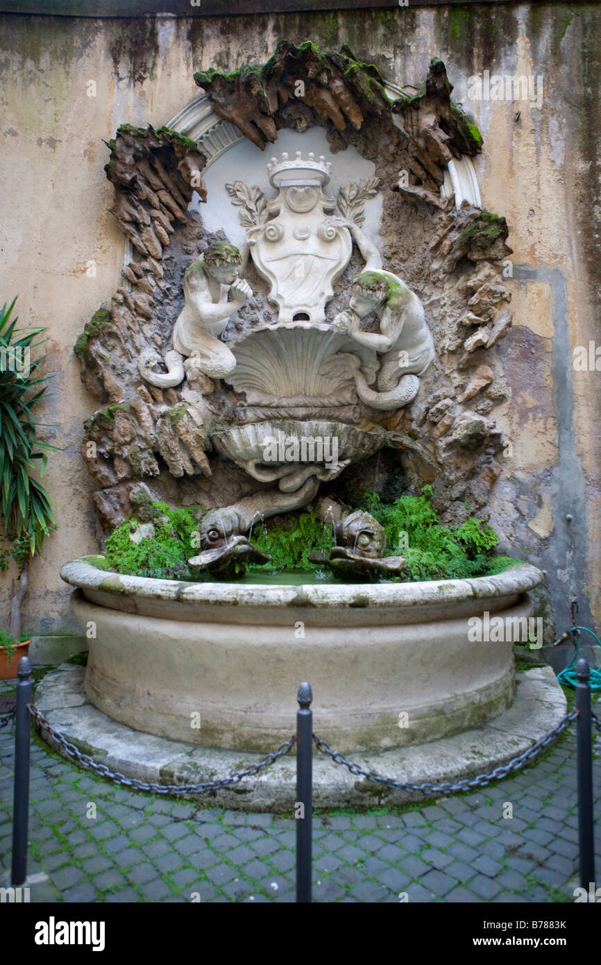 Fountain in private square garden in Rome Italy Stock Photo - Alamy