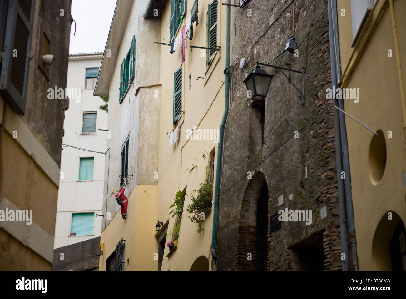 Italian street with santa making an escape Stock Photo - Alamy