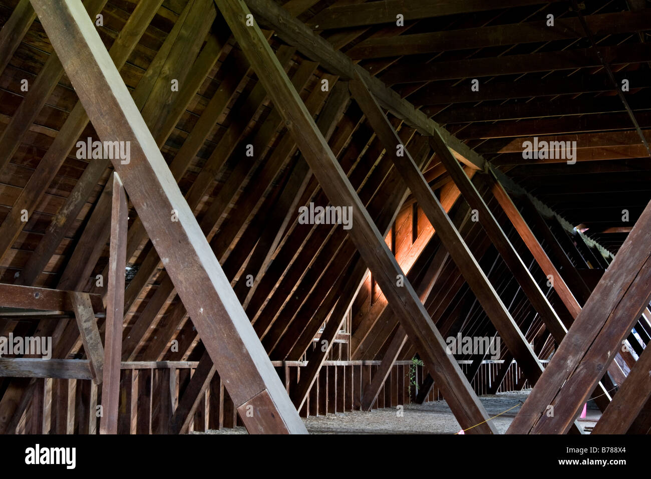 Sunlight illuminates rafters in an old barn at the Longview Farms ...