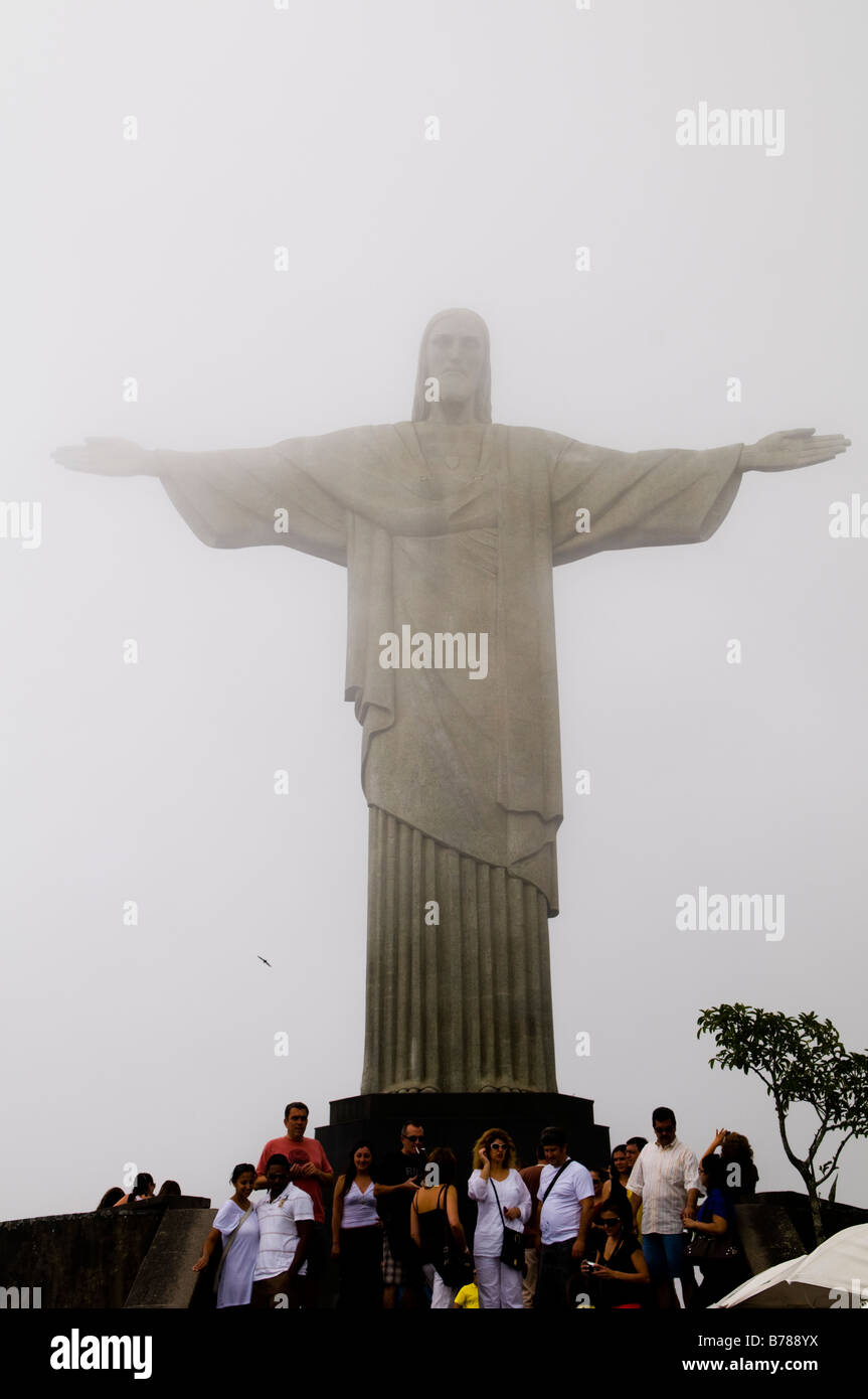 Tourist gather in front of The famous statue of Christ the Redeemer ...