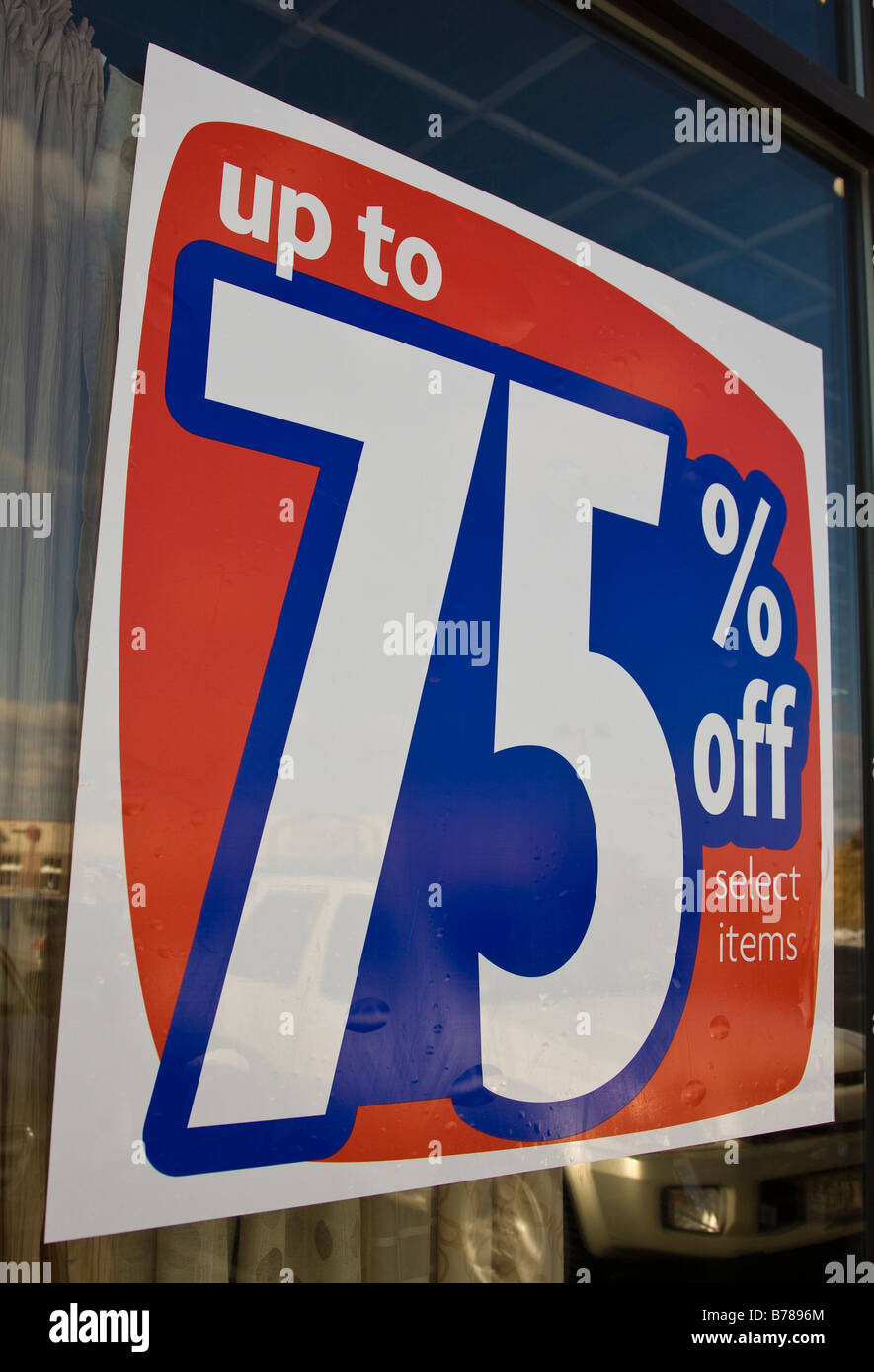 Discount sign in a store window Stock Photo - Alamy