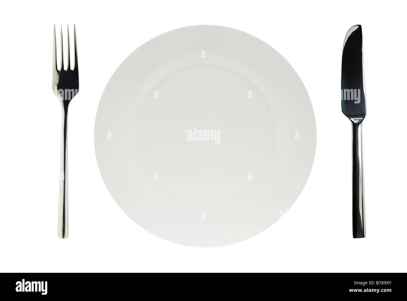 Kitchen knife on plate Cut Out Stock Images & Pictures - Alamy