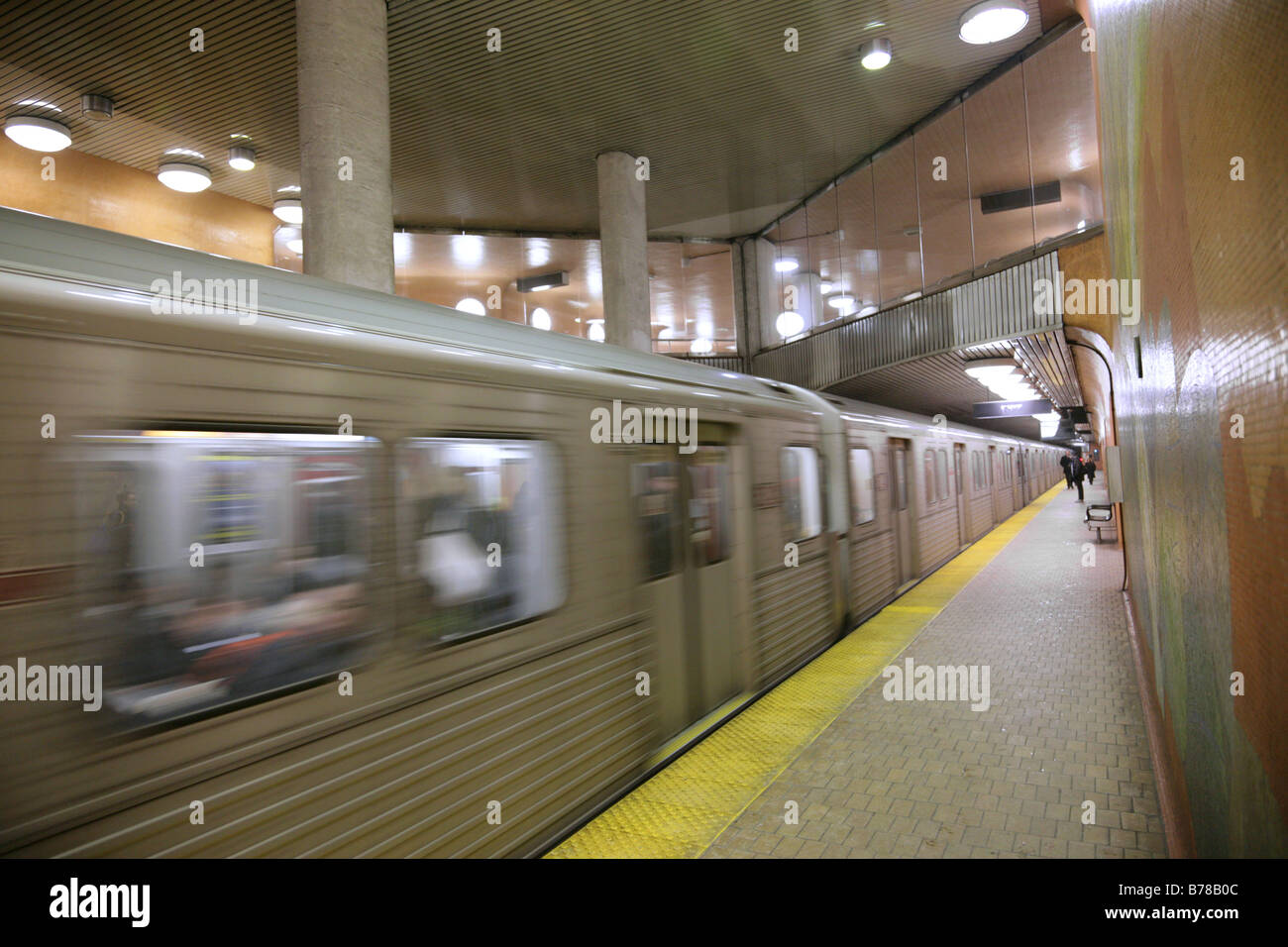 Subway train leaving station Stock Photo - Alamy