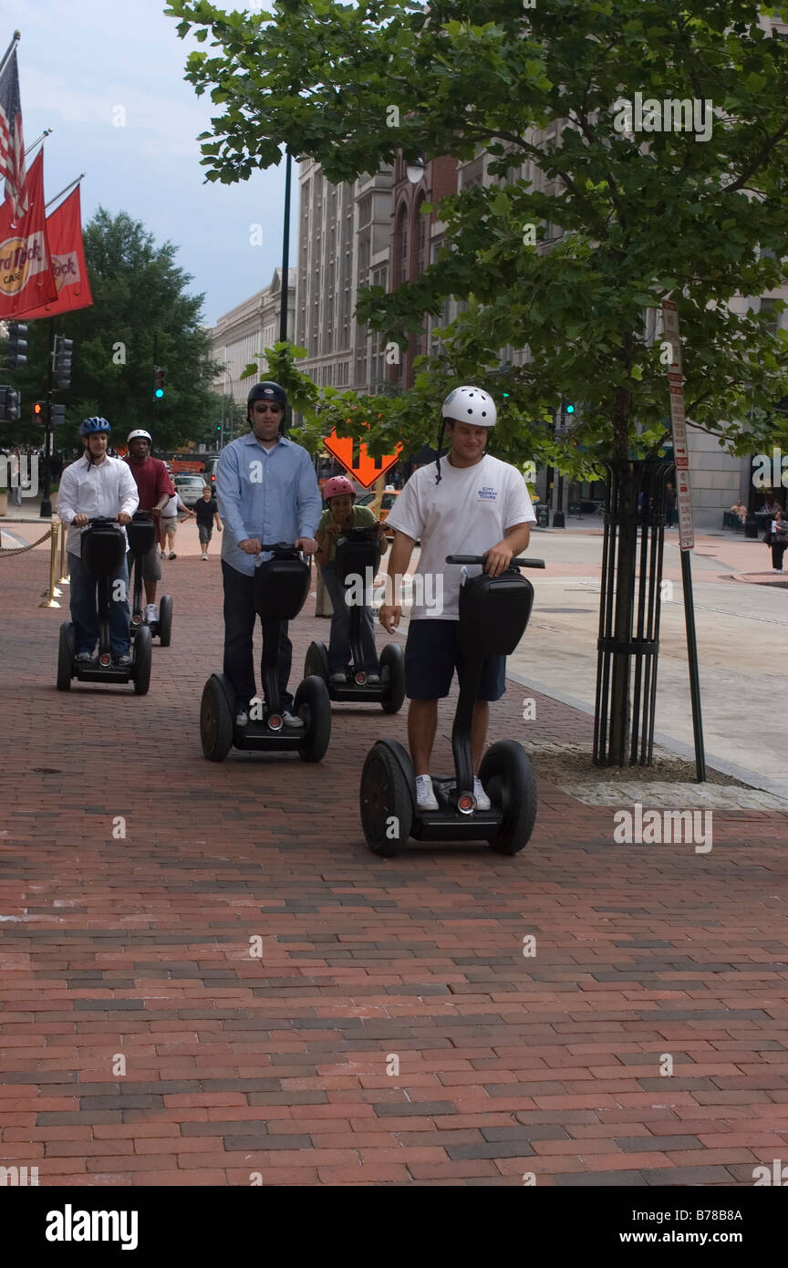 Tour guide leads tourists through streets of Washington, DC, Segway ...