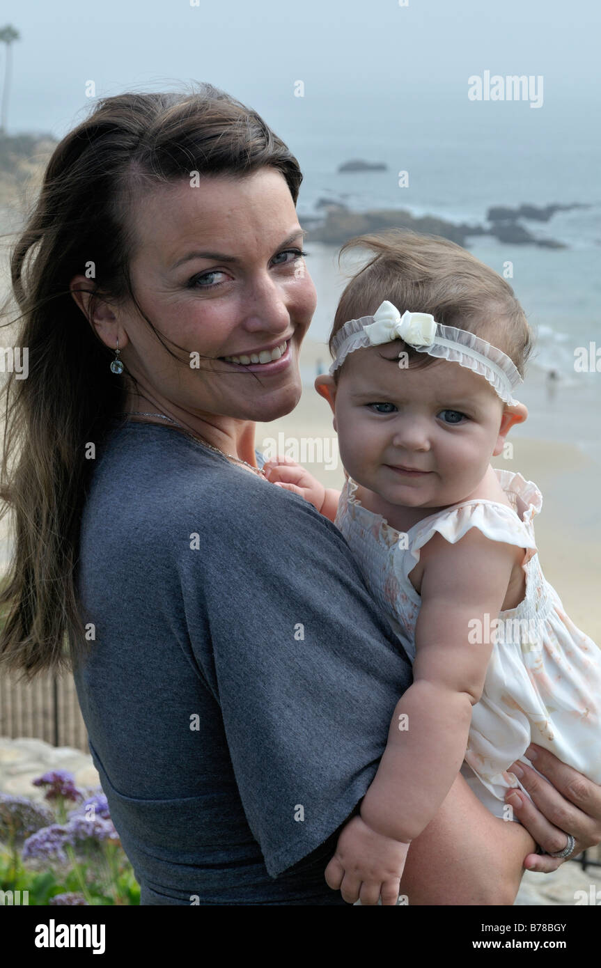 Young American mother holding her baby Stock Photo - Alamy