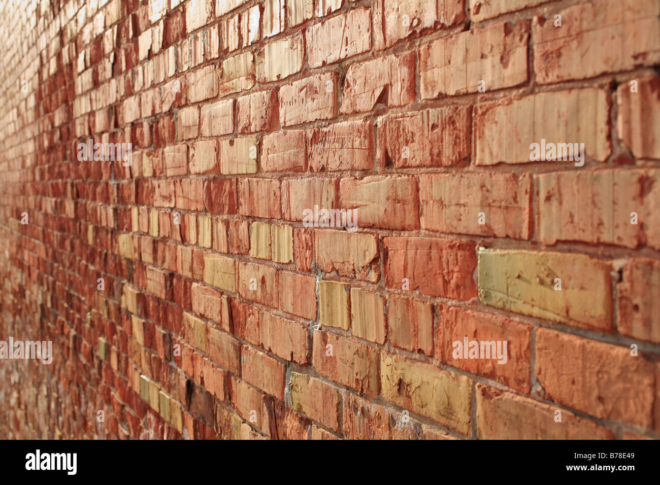 old red brick wall receding into distance Stock Photo - Alamy