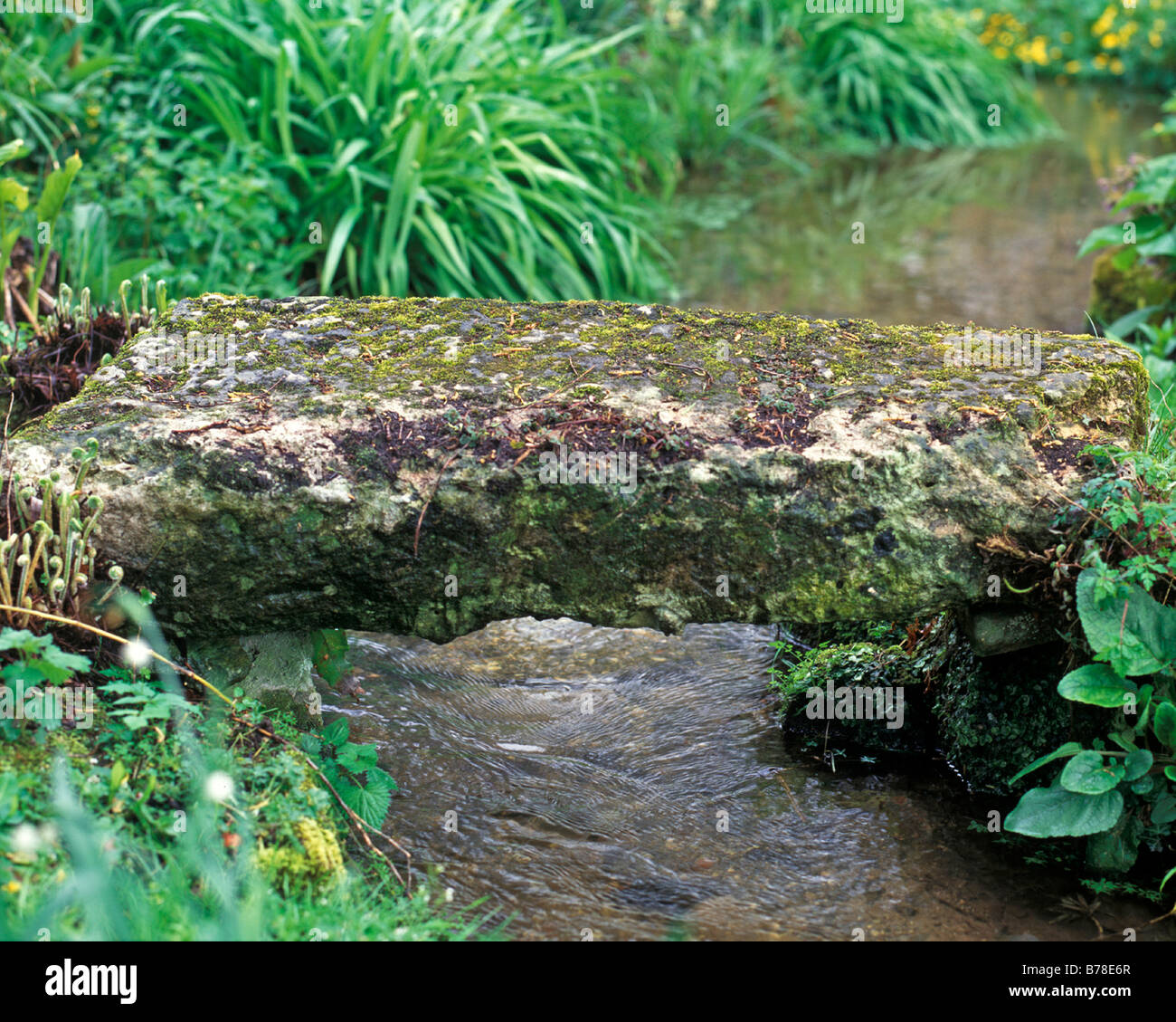WEATHERED NATURAL SINGLE STONE BRIDGE ACROSS SMALL STREAM Stock Photo ...