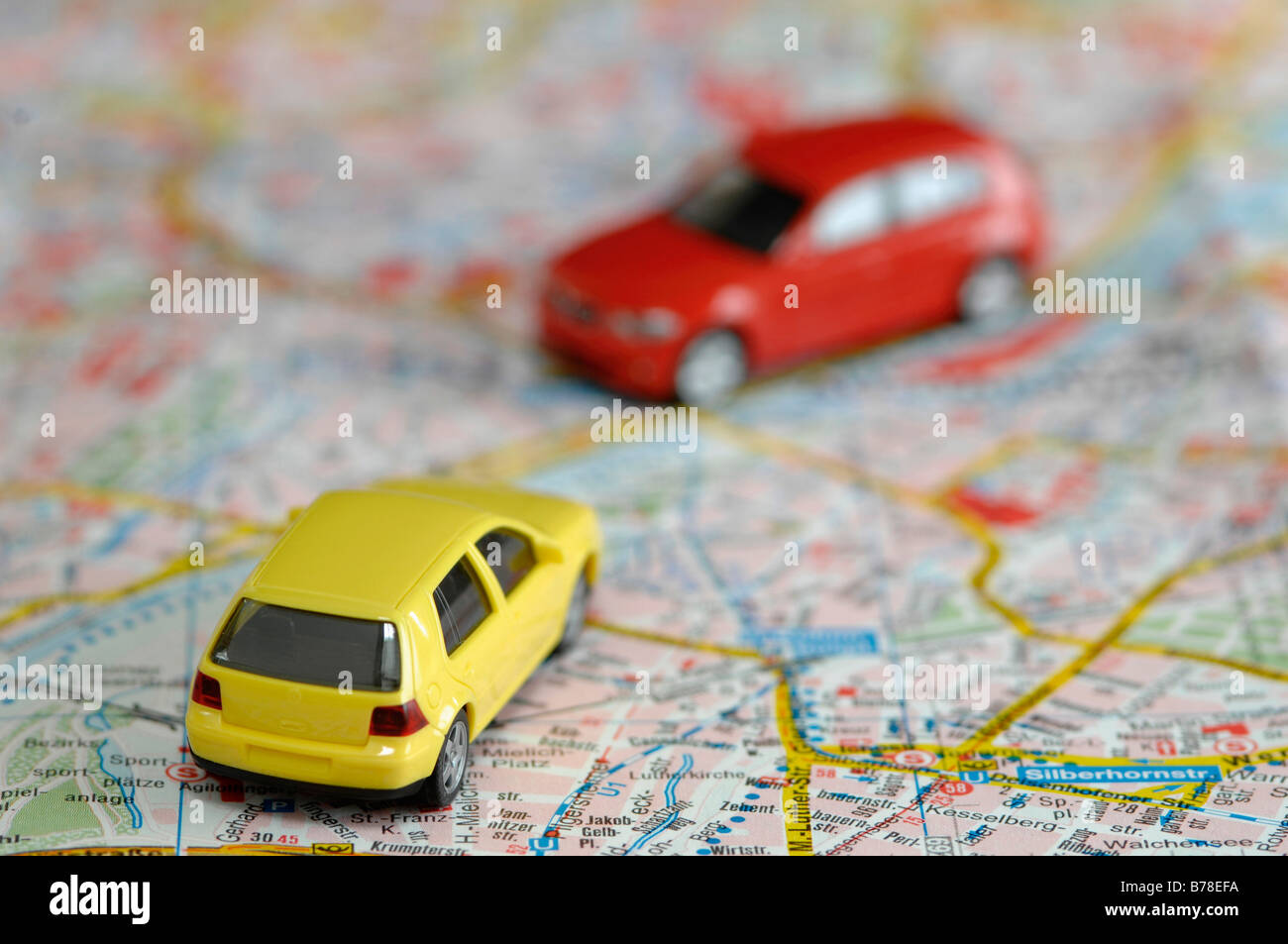 Toy cars on city map, close up Stock Photo - Alamy