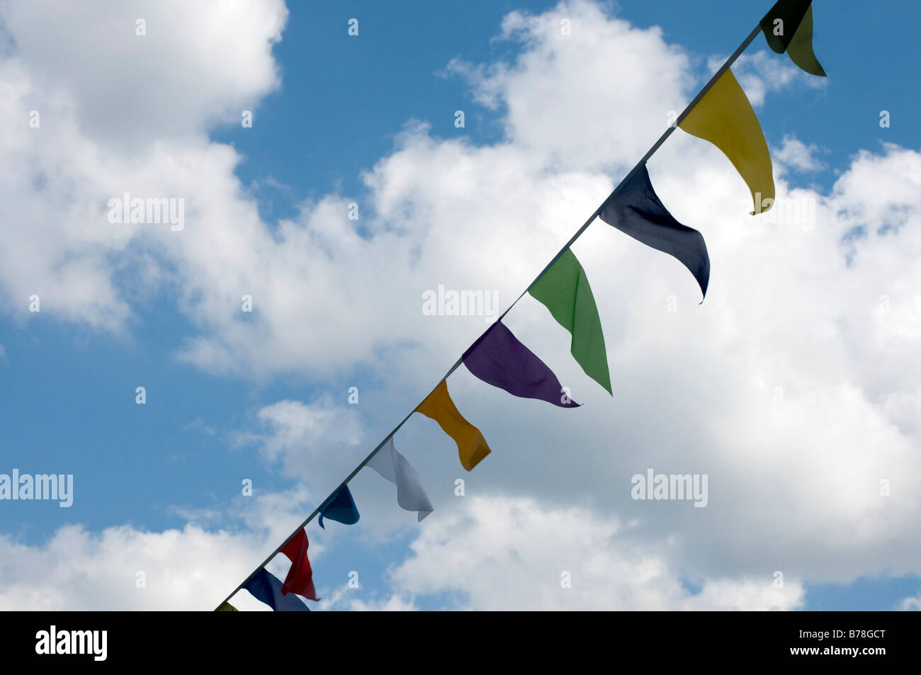 Flags hanging against blue sky Stock Photo - Alamy