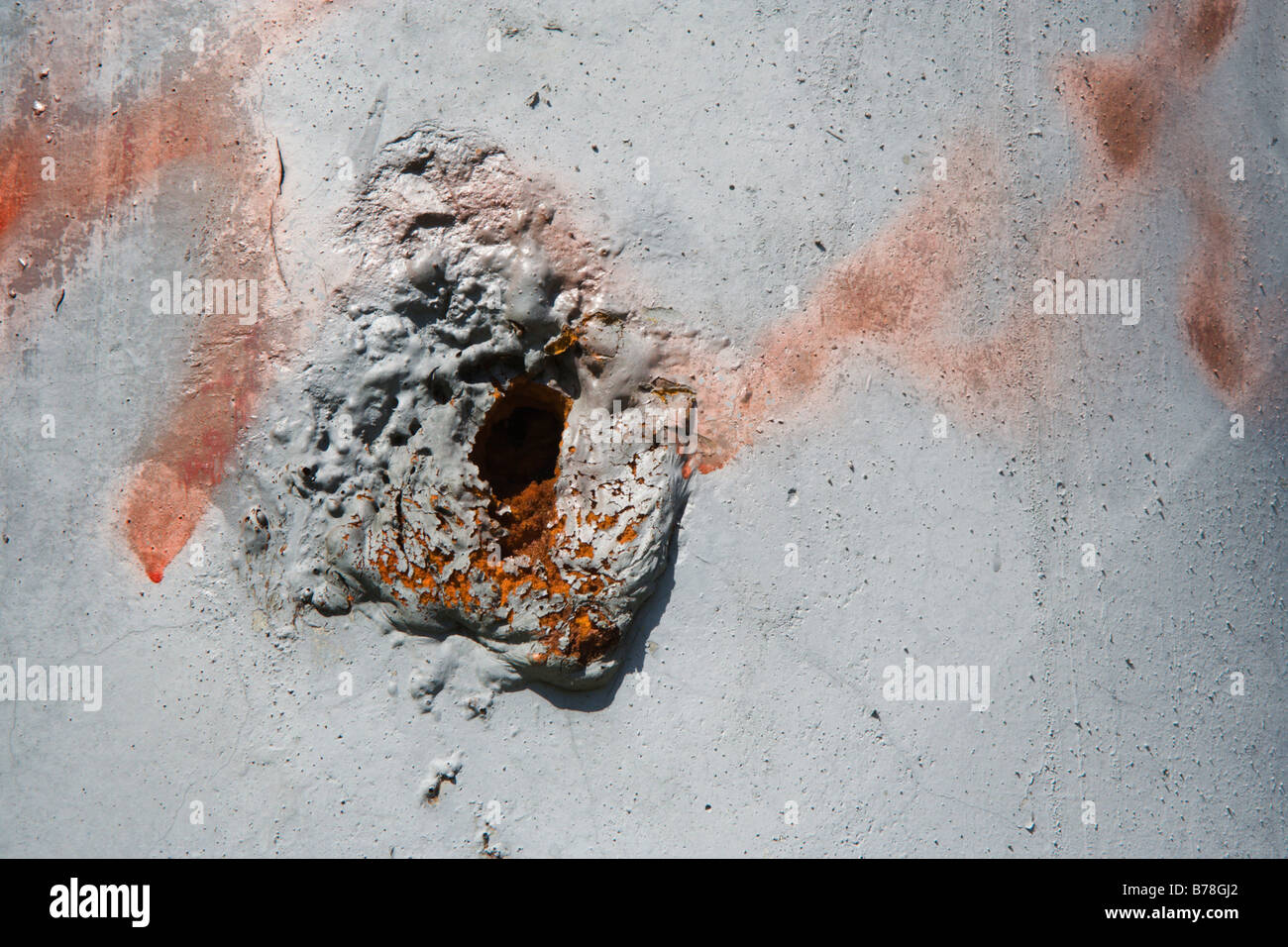 corrosion in the form of hole in thick iron plate Stock Photo - Alamy