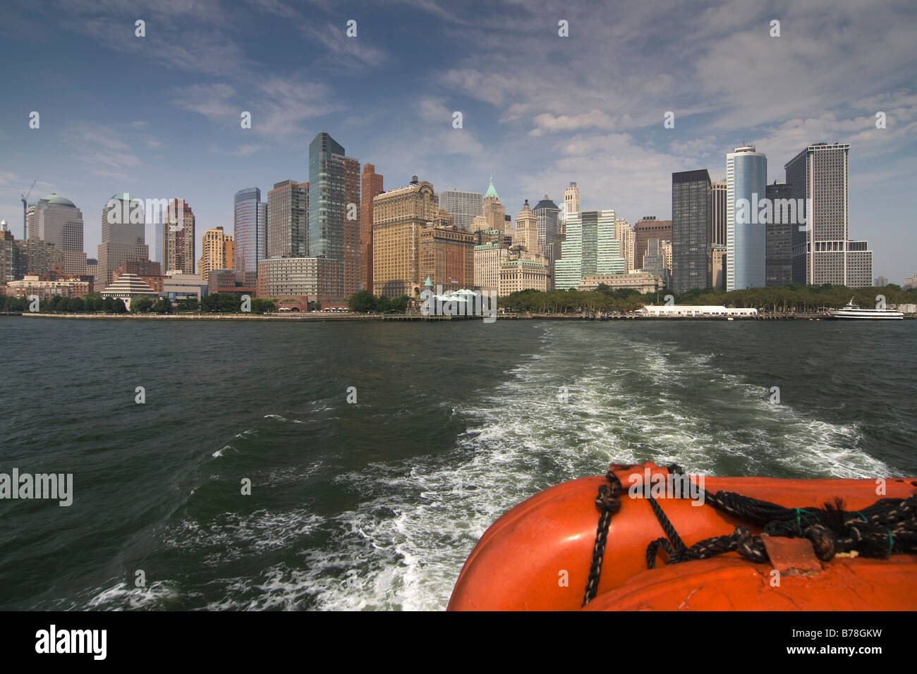 Rescue buoys and the skyline of Manhattan from a ferry heading towards ...