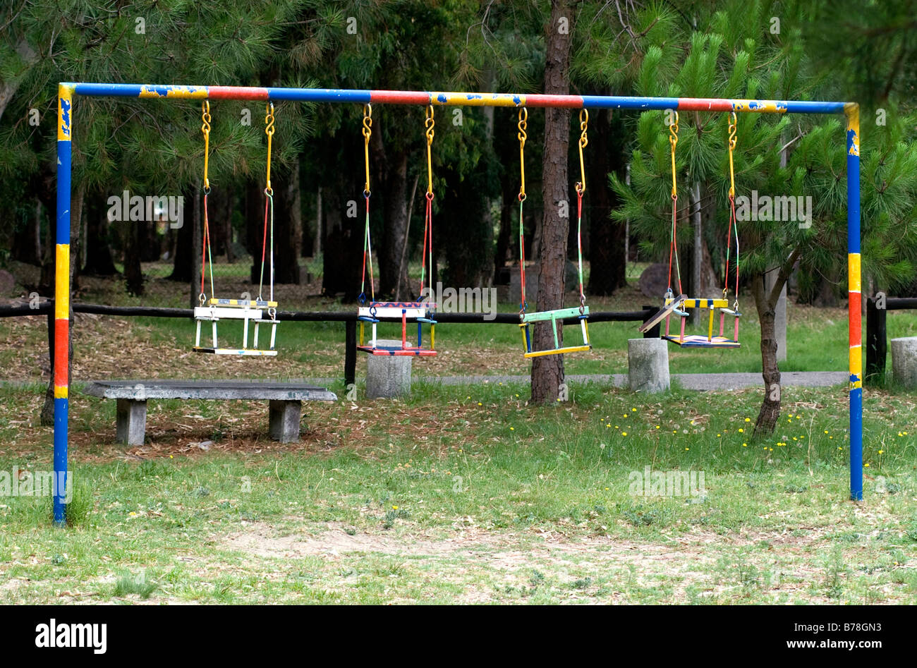 Swings in a playground hi-res stock photography and images - Alamy