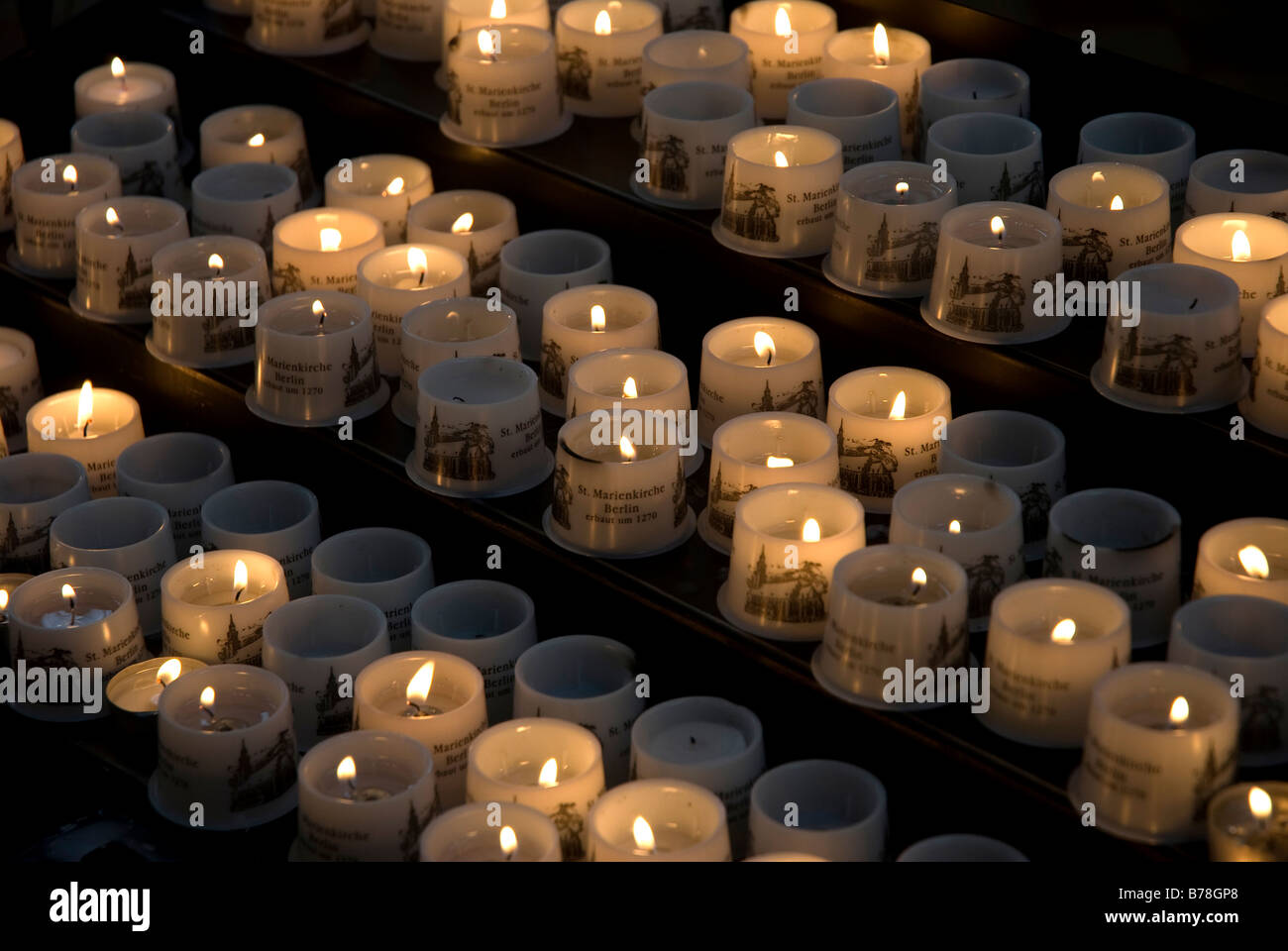 Many candles one candle lit hi-res stock photography and images - Alamy