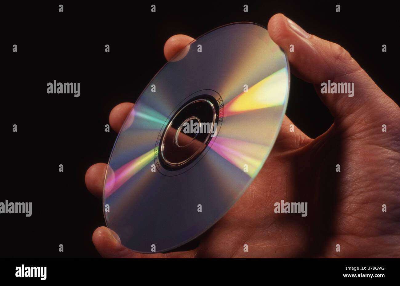 Hand holding CD DVD Stock Photo - Alamy