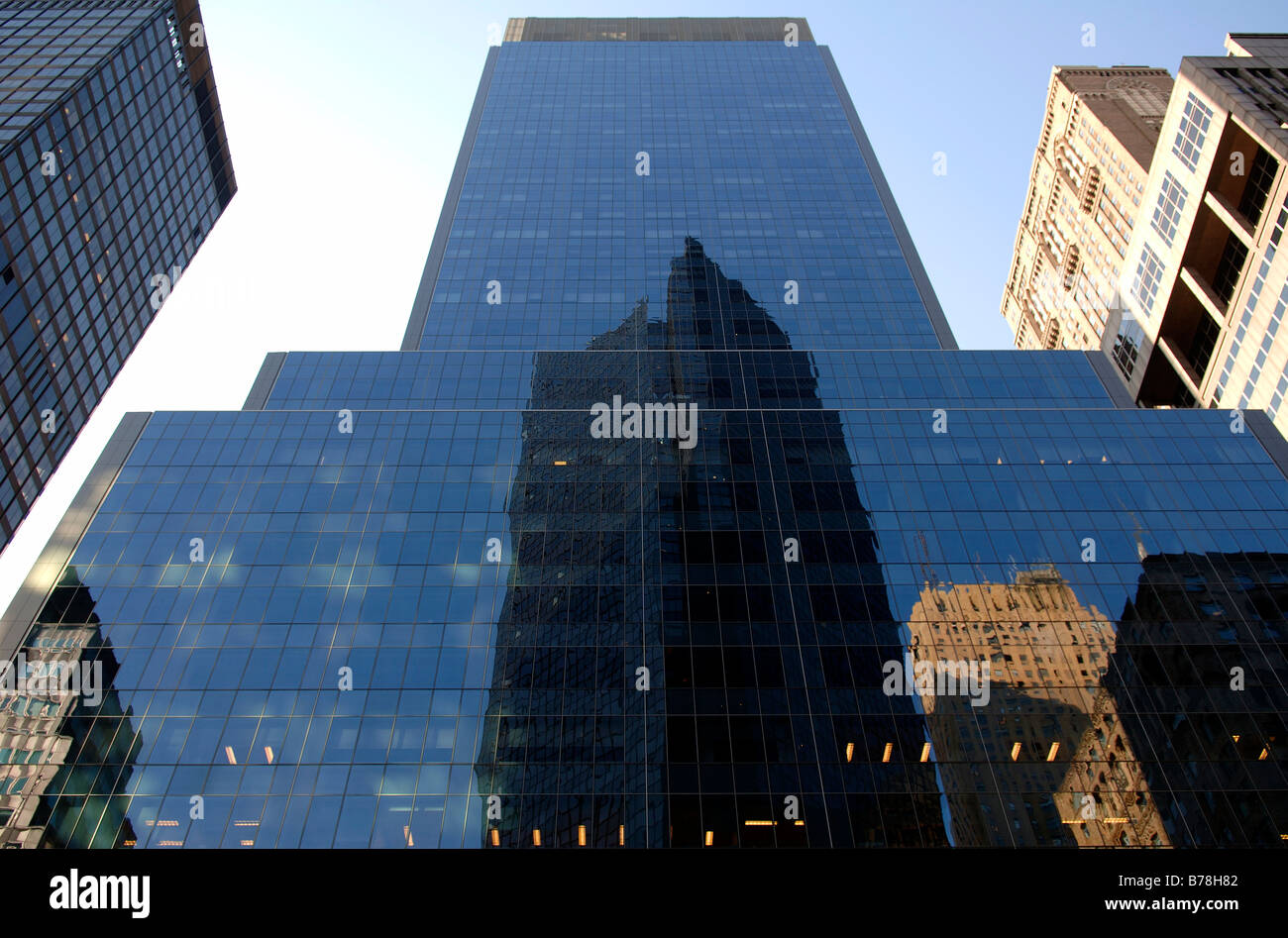 Reflection in the glass facade of a skyscraper, New York City, USA ...