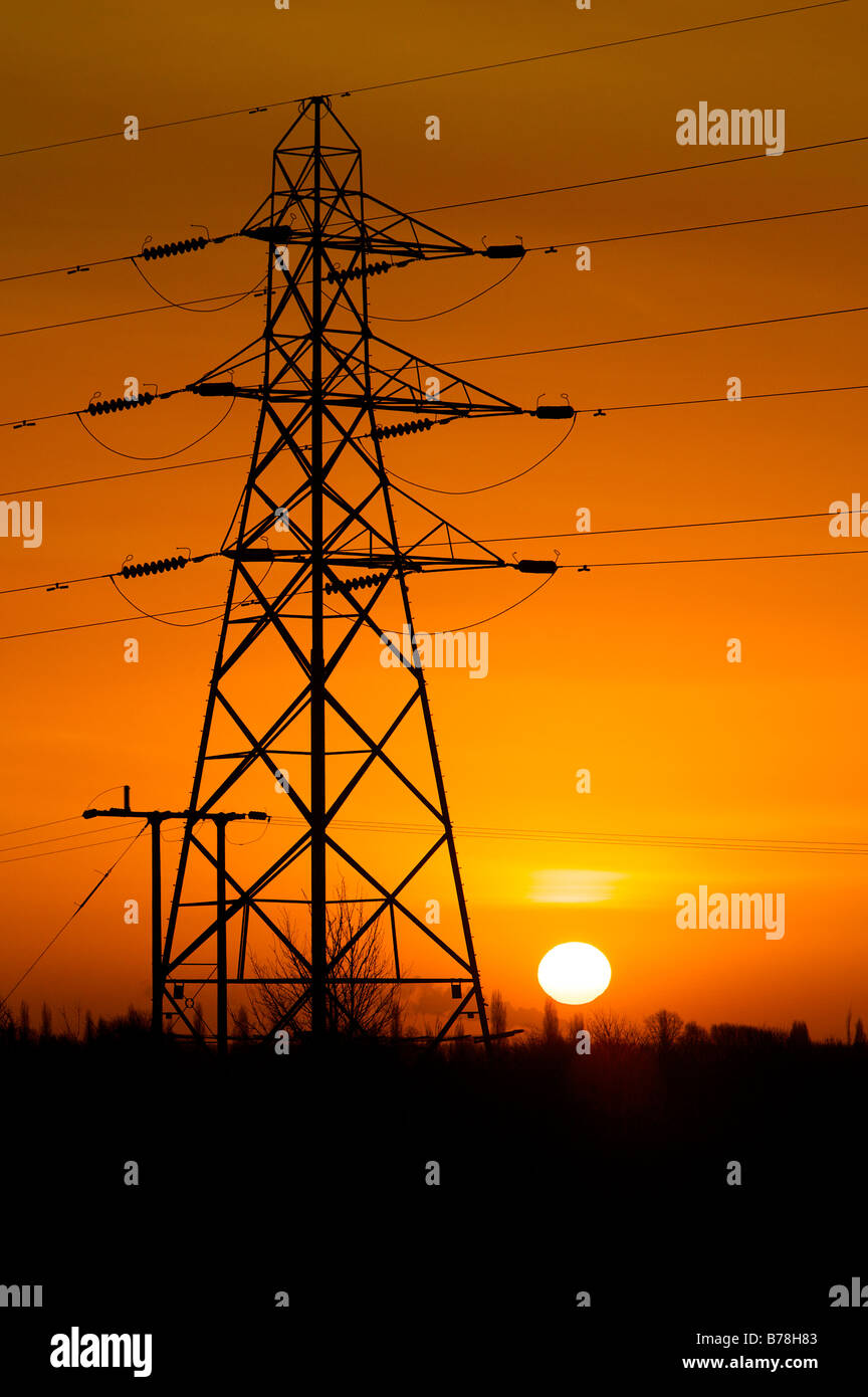 Sunrise over a national grid pylon Stock Photo - Alamy