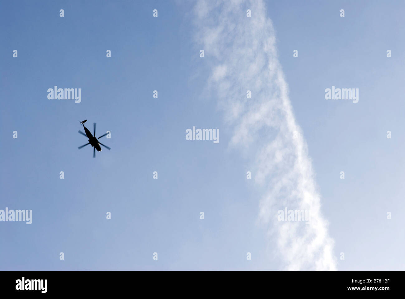 Helicopter in sky, low angle view Stock Photo - Alamy
