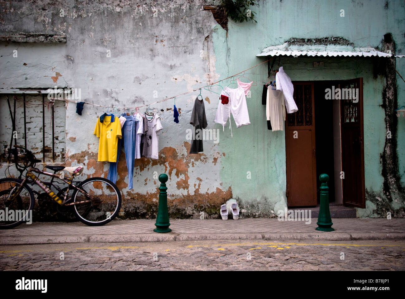 Washing hung up to dry in a back street of Macau Stock Photo - Alamy