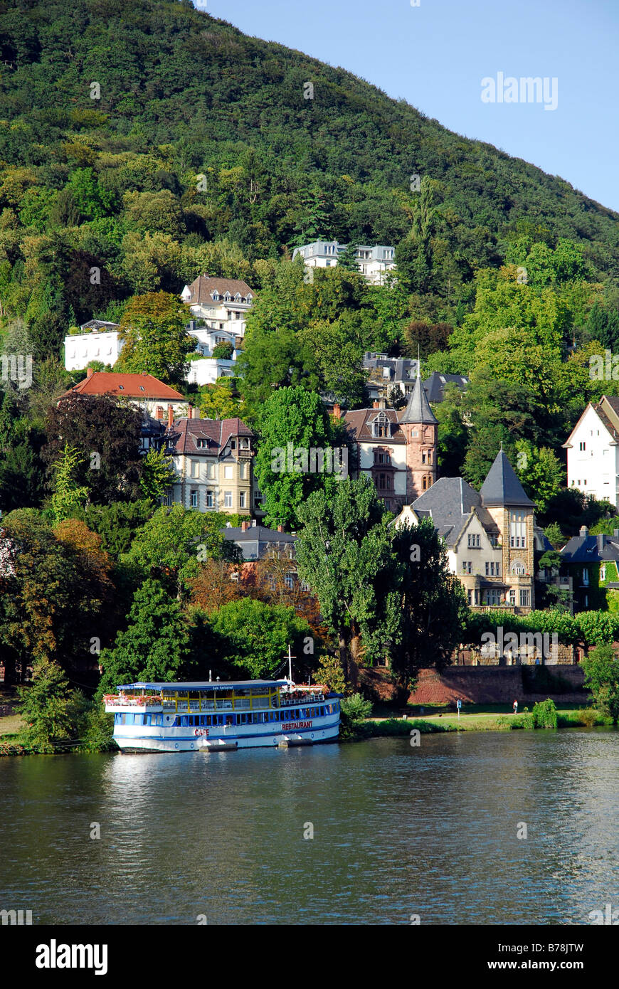 Boat with cafe and restaurant on Neckar River, elegant residential area ...