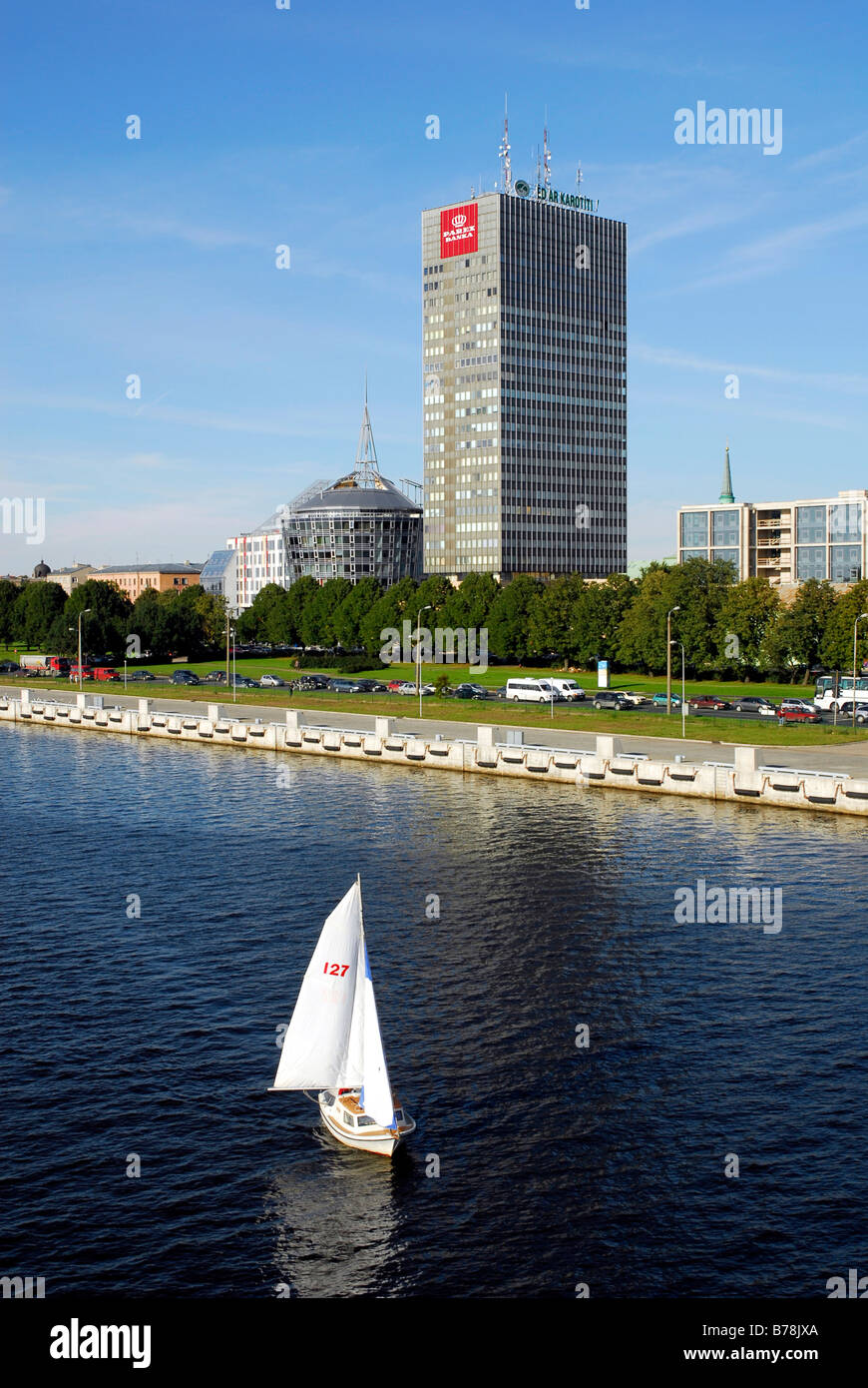 Daugava river with a sailing boat, as seen from the Vansu tilts bridge ...