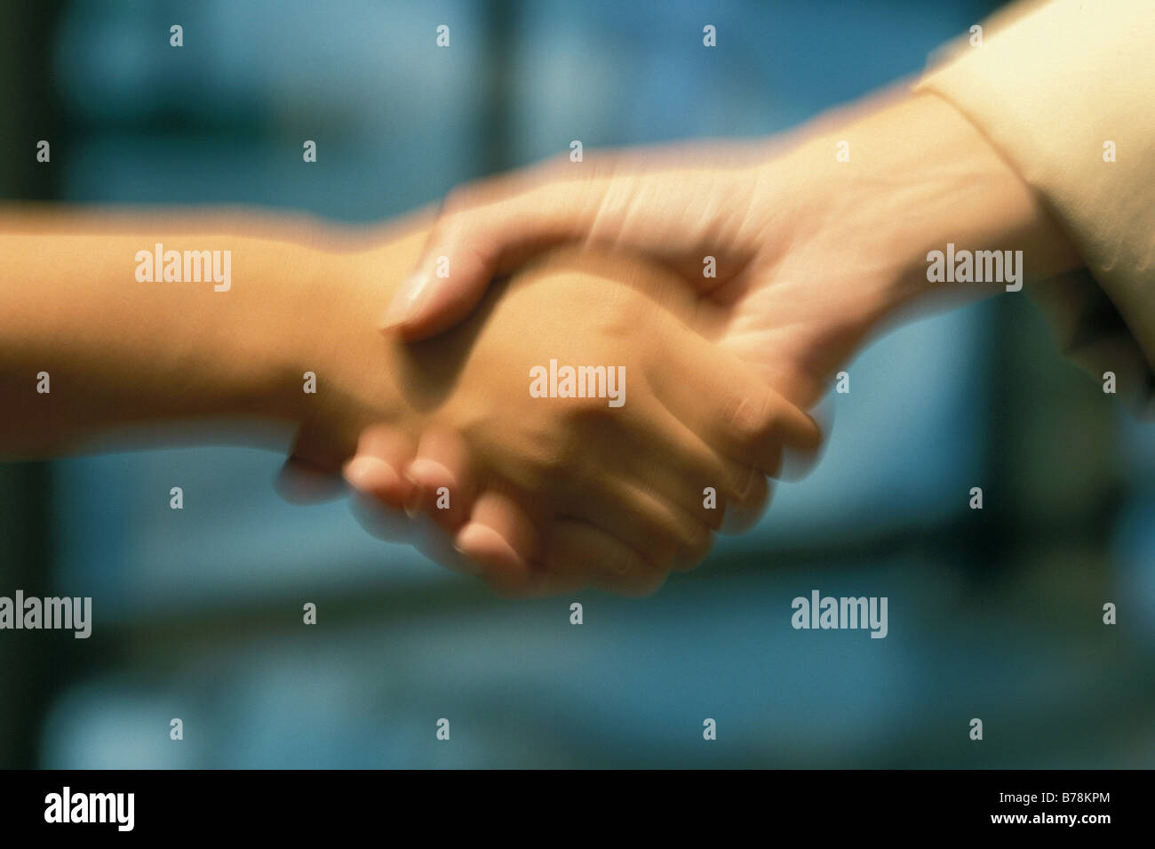 Man & woman shaking hands Stock Photo - Alamy