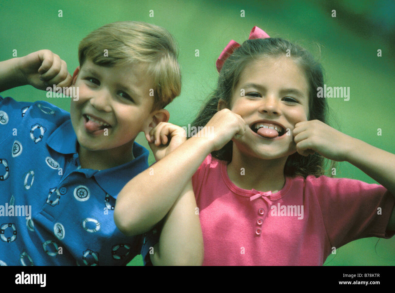 Kids making faces Stock Photo - Alamy