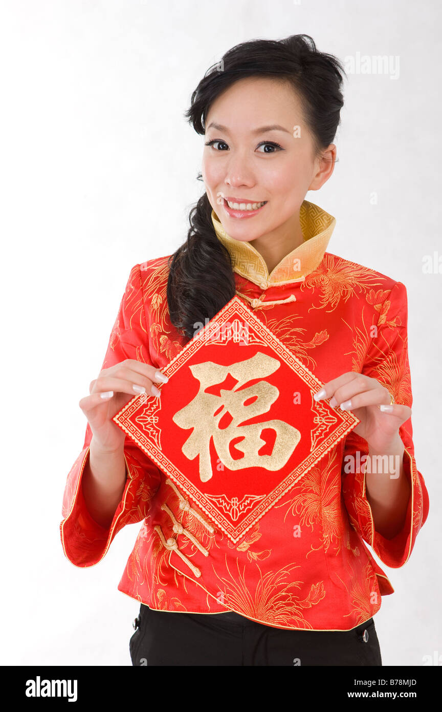 Young woman holding Chinese script and smiling at the camera Stock ...