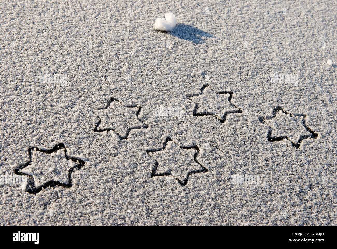 Five stars drawn into snow, elevated view Stock Photo - Alamy