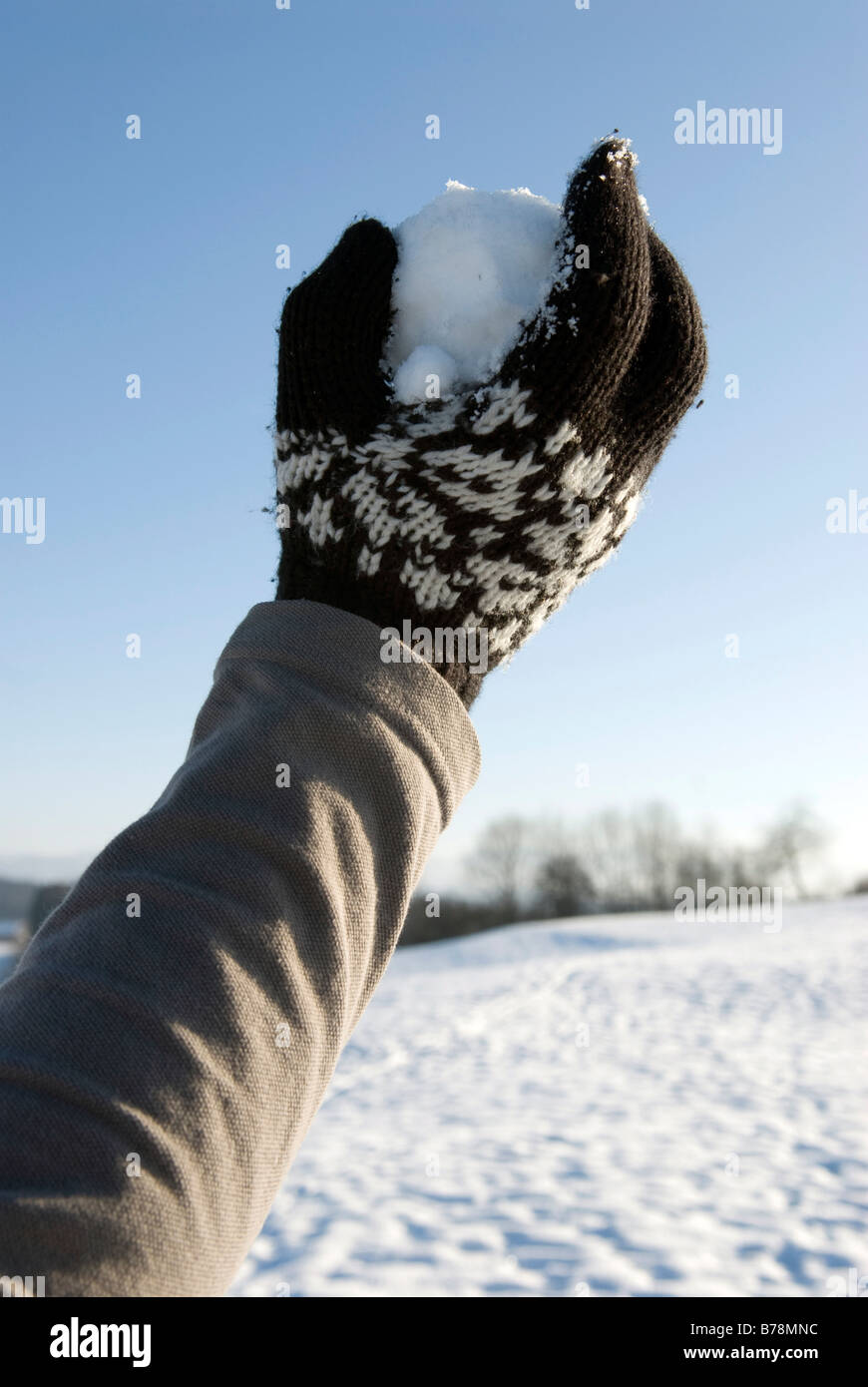 Human hand holding snowball, close-up Stock Photo - Alamy