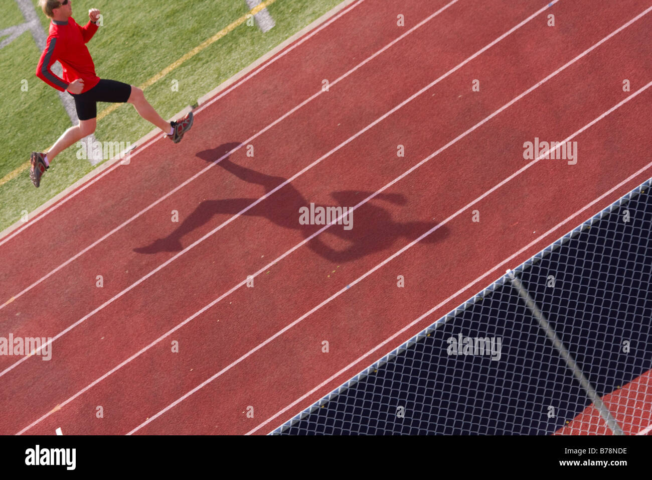 A man running on a track while training in Reno in Nevada Stock Photo ...
