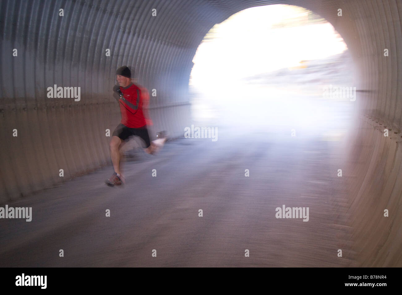 A man running through a tunnel in Reno in Nevada Stock Photo - Alamy