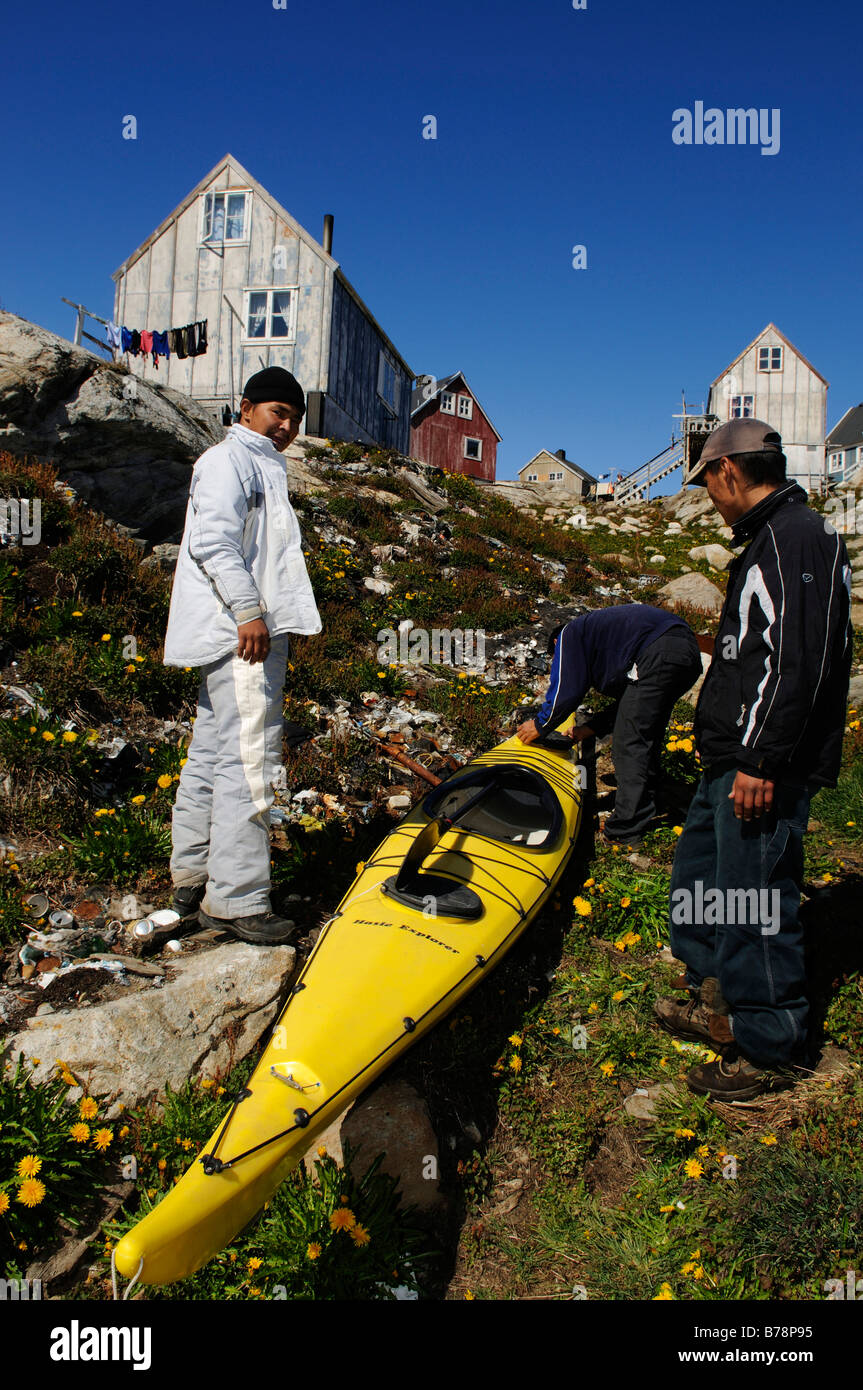 Inuit with kayak in Tineteqilag, Ikasartivaq Fjord, East Greenland ...