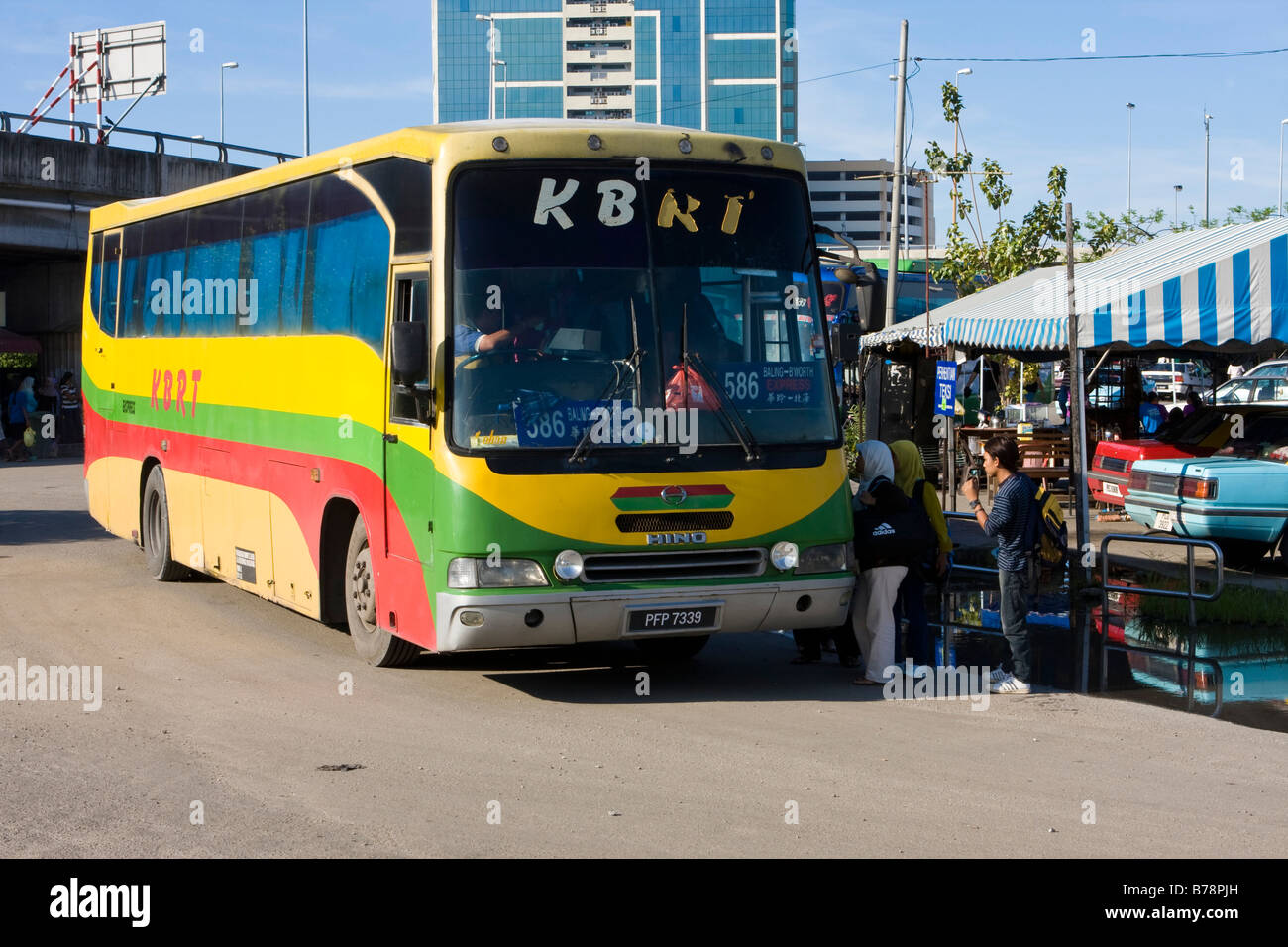 An express bus taking on passengers at Butterworth, Malaysia Stock ...