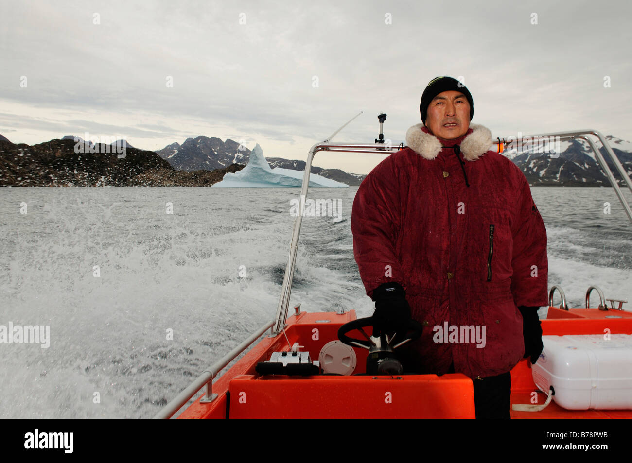 Inuit on a boat tour, icebergs near Ammassalik, East Greenland Stock ...