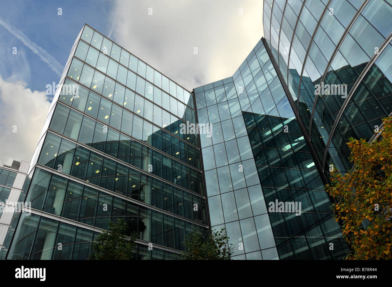 Angular modern contemporary office block sky scraper building Stock ...