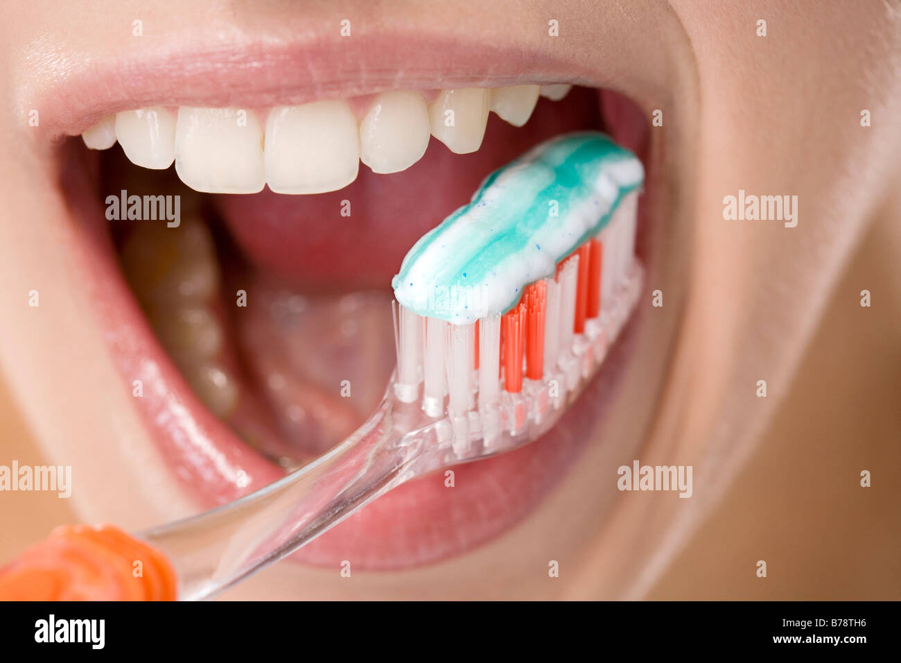 Young woman brushing her teeth, close up Stock Photo - Alamy