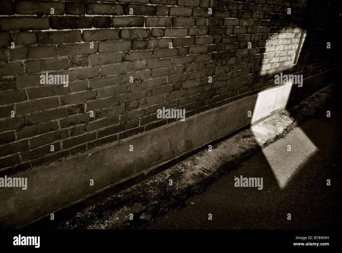 Window reflection on dark alley way Stock Photo - Alamy