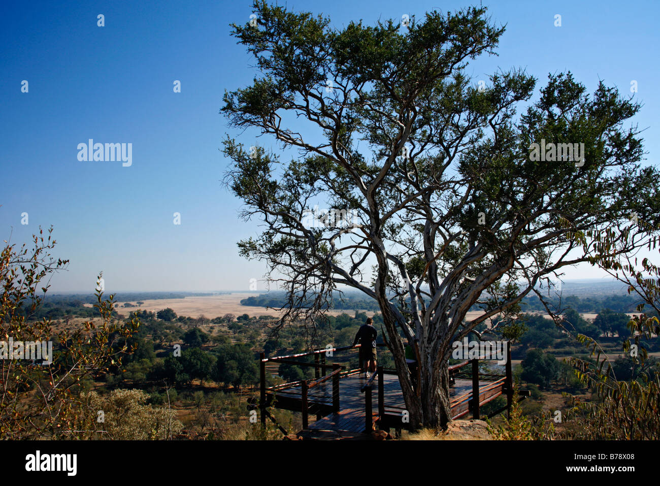 Tourists on a viewing deck overlooking the confluence of the Shashe and ...