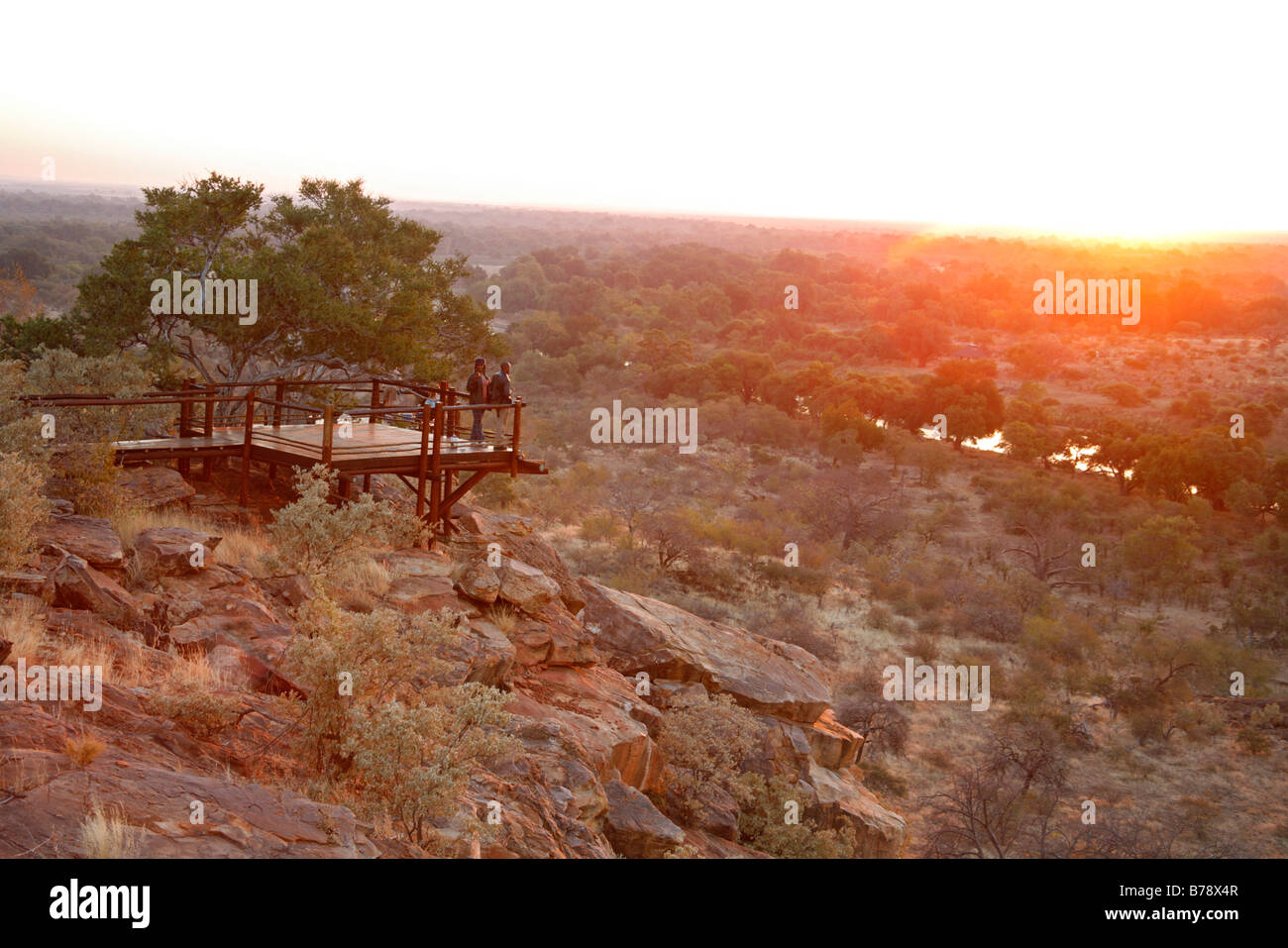 Tourists on a viewing deck overlooking the confluence of the Shashe and ...