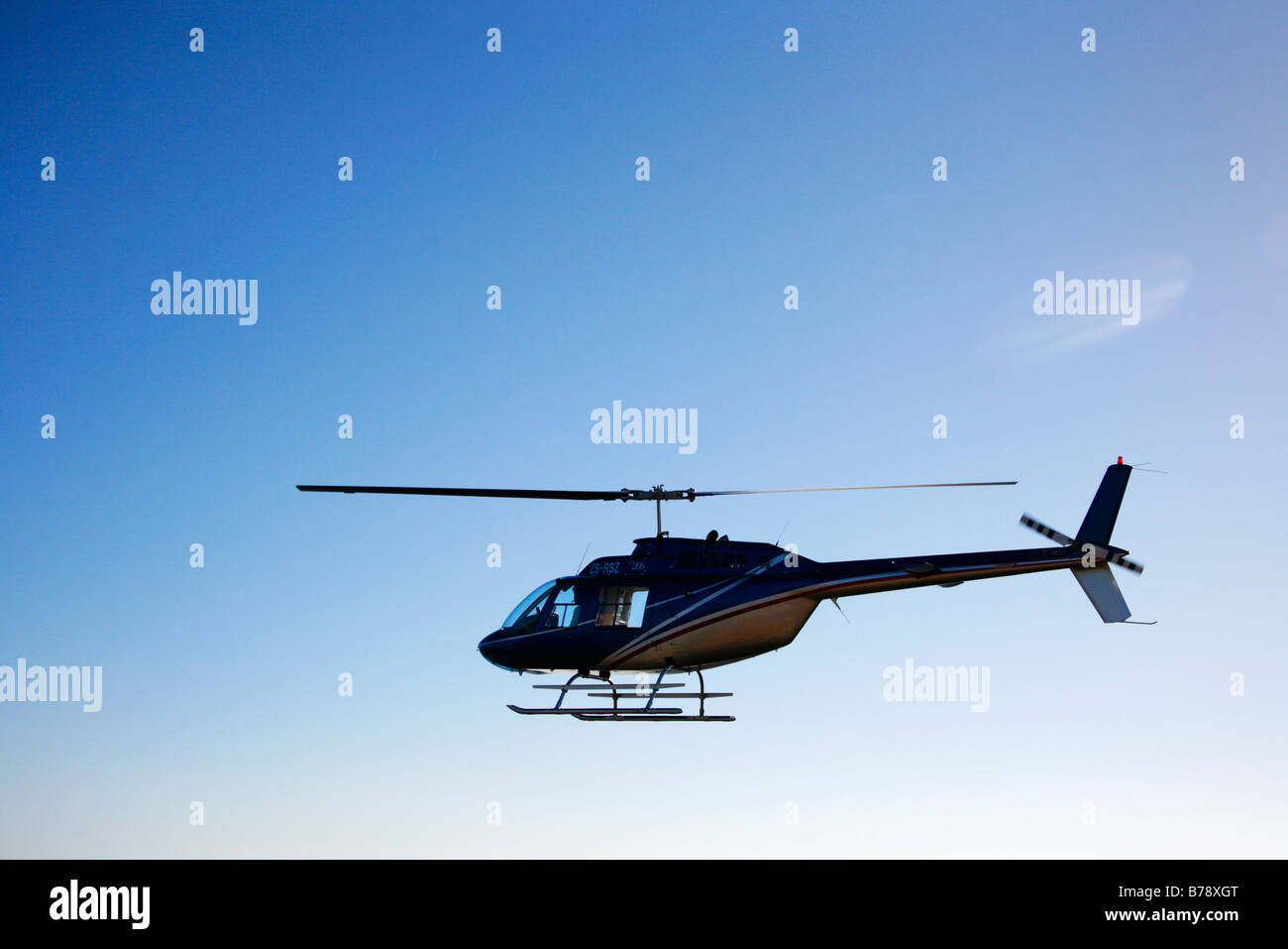 Helicopter in flight Stock Photo - Alamy