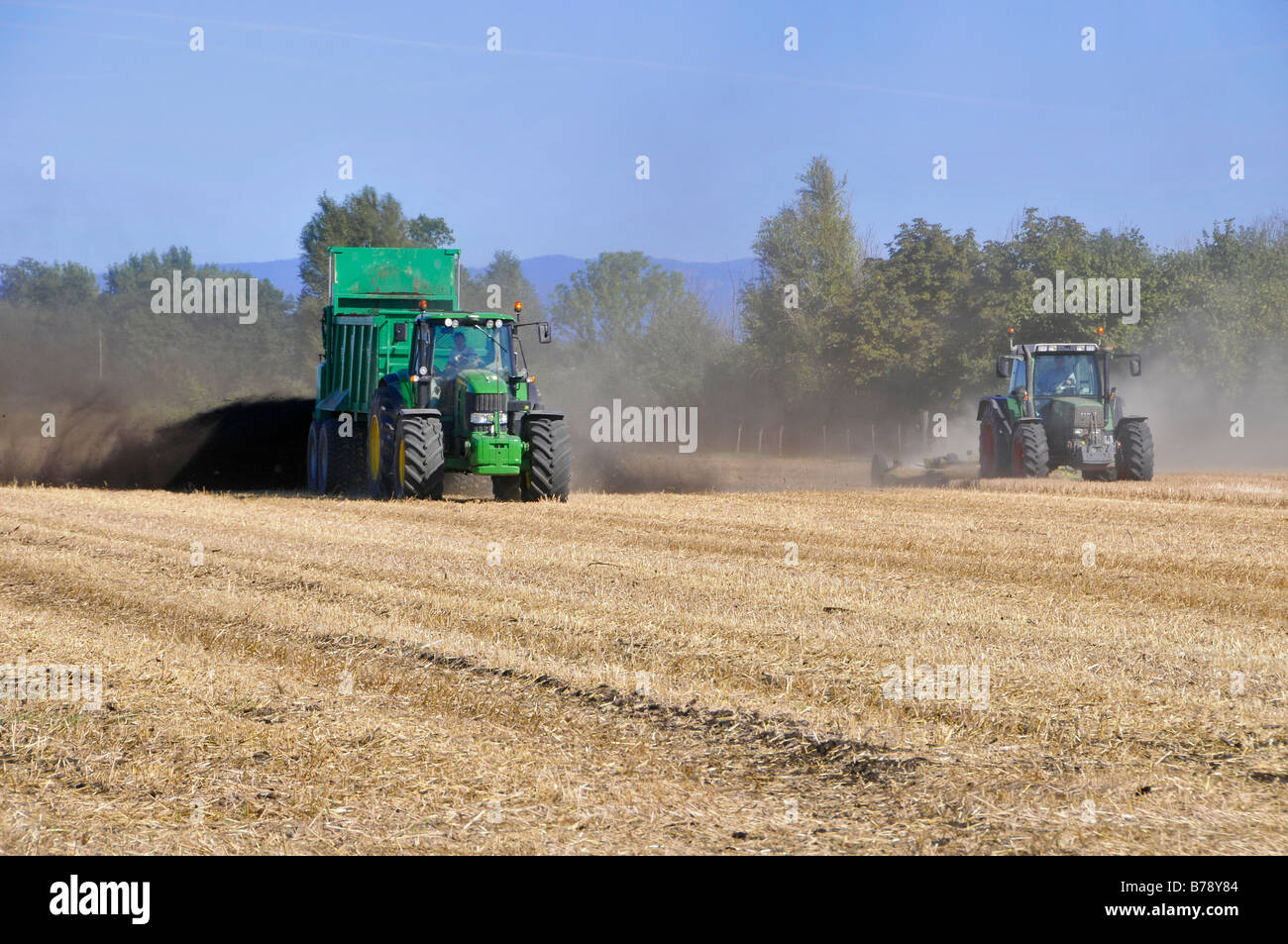 Tractor spreading manure Stock Photo - Alamy
