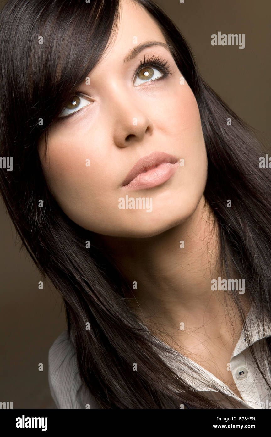 Young woman looking up, portrait Stock Photo - Alamy