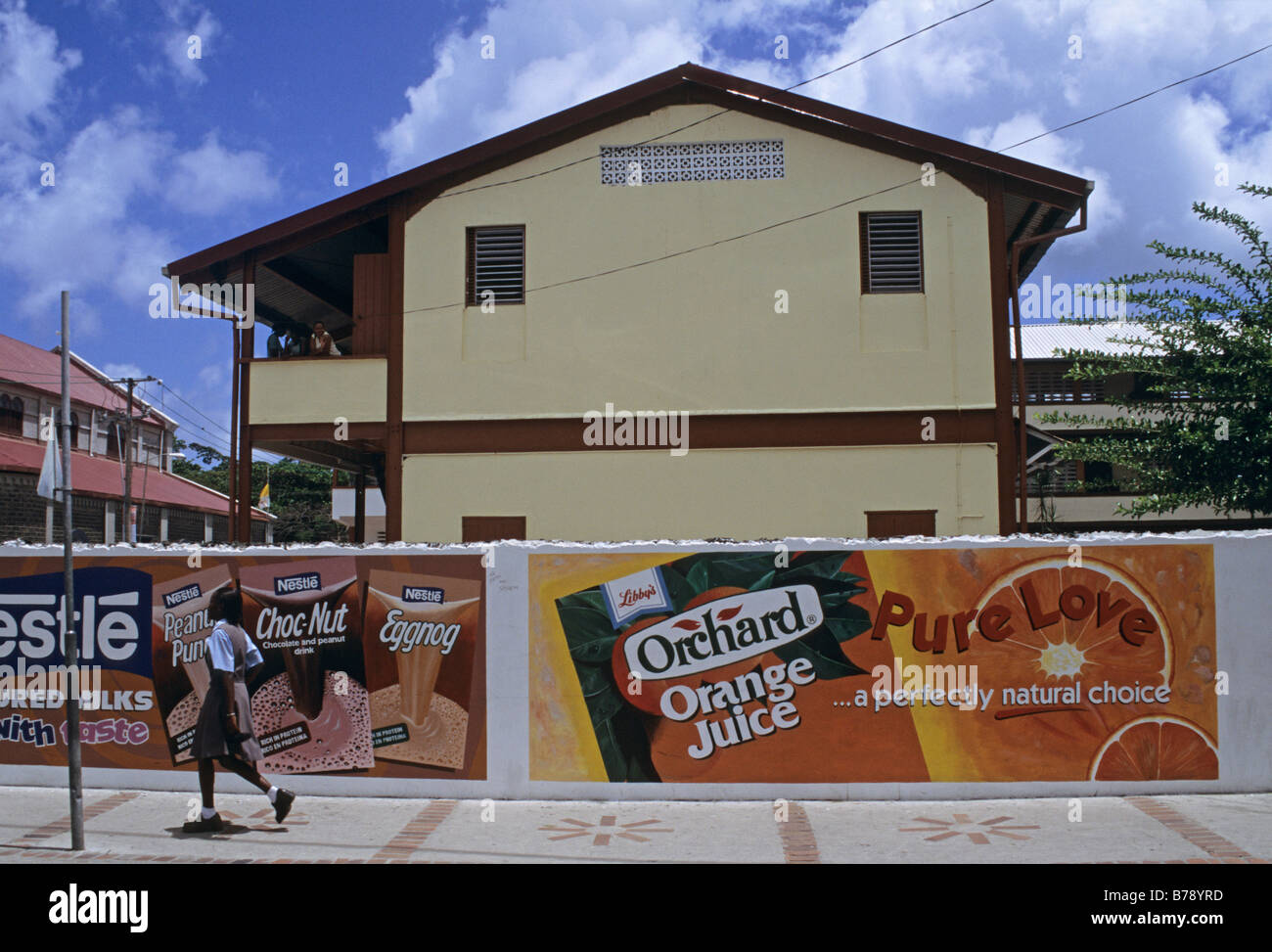 girl walking on a street of Castries the main town of Saint Lucia ...
