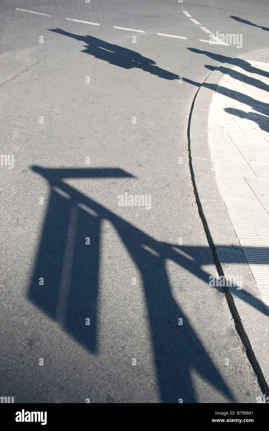 Silhouettes of street signs and people on sidewalk Stock Photo - Alamy