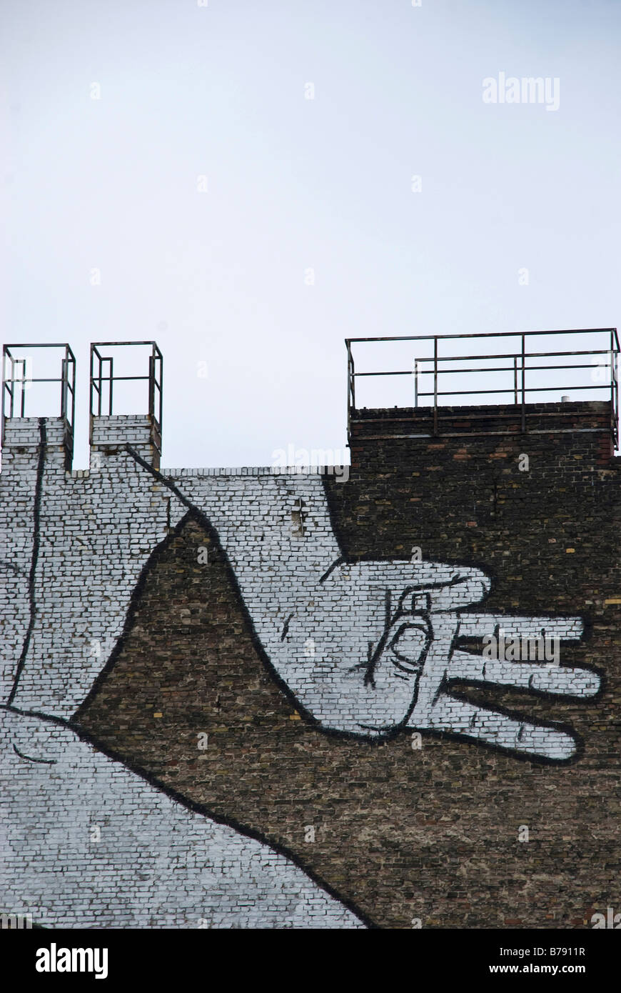 Brick wall with graffiti, hand sign motif Stock Photo - Alamy