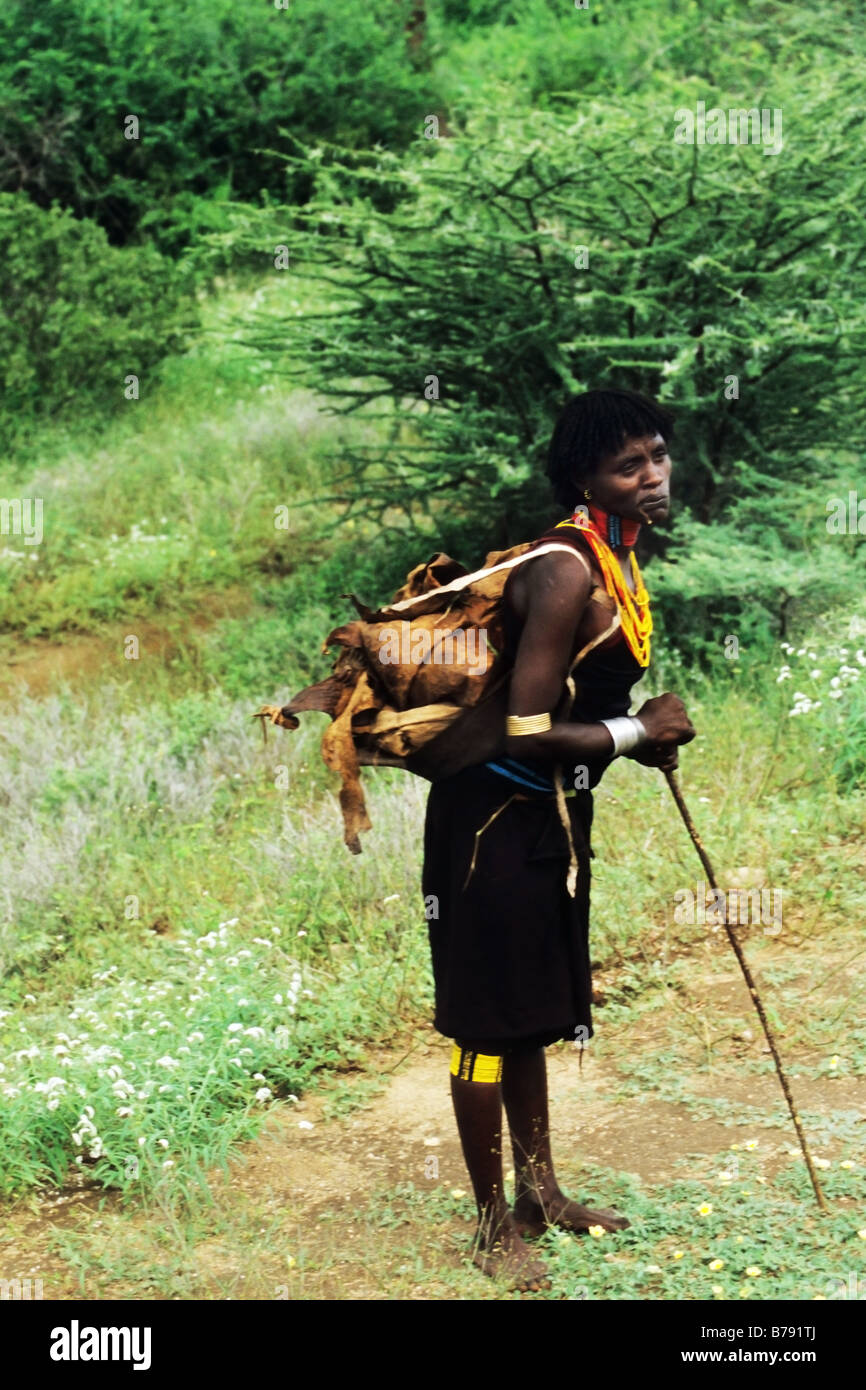A Bana woman walks to her village Stock Photo - Alamy