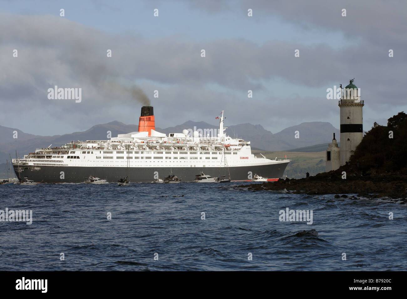 QE2 sailing up the Firth of Clyde for the final time passing the Cloch ...
