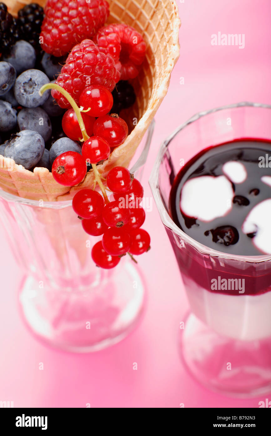 Red fruit jelly and wild berries, close-up Stock Photo - Alamy