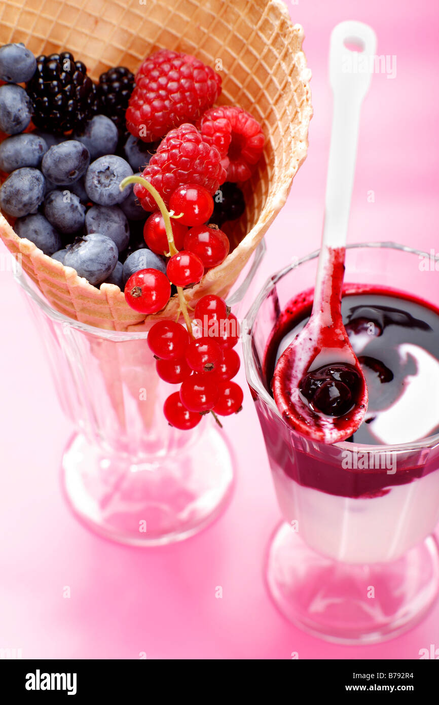 Red fruit jelly and wild berries, close-up Stock Photo - Alamy